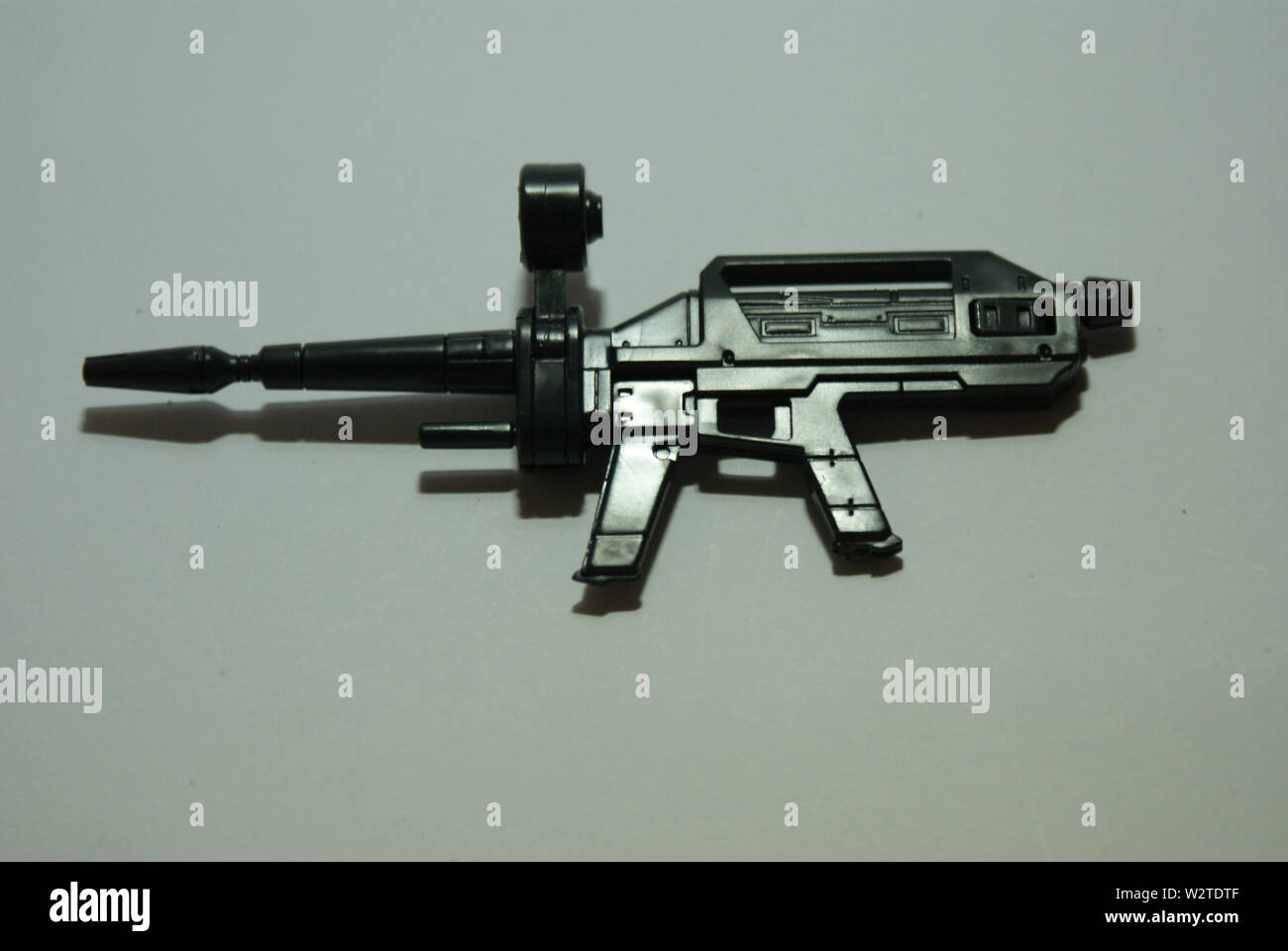 closeup of a plastic futuristic toy gun on a white background Stock ...