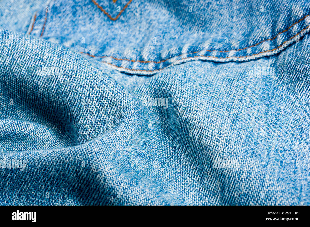clothing items blue washed faded jeans cotton fabric texture with seams ...