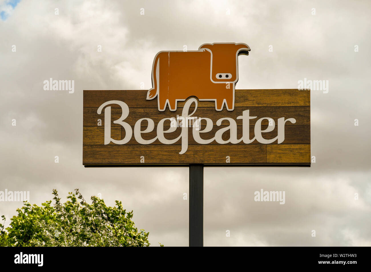 SWINDON, ENGLAND - JULY 2018: Signs on the outside of a Beefeater chain ...