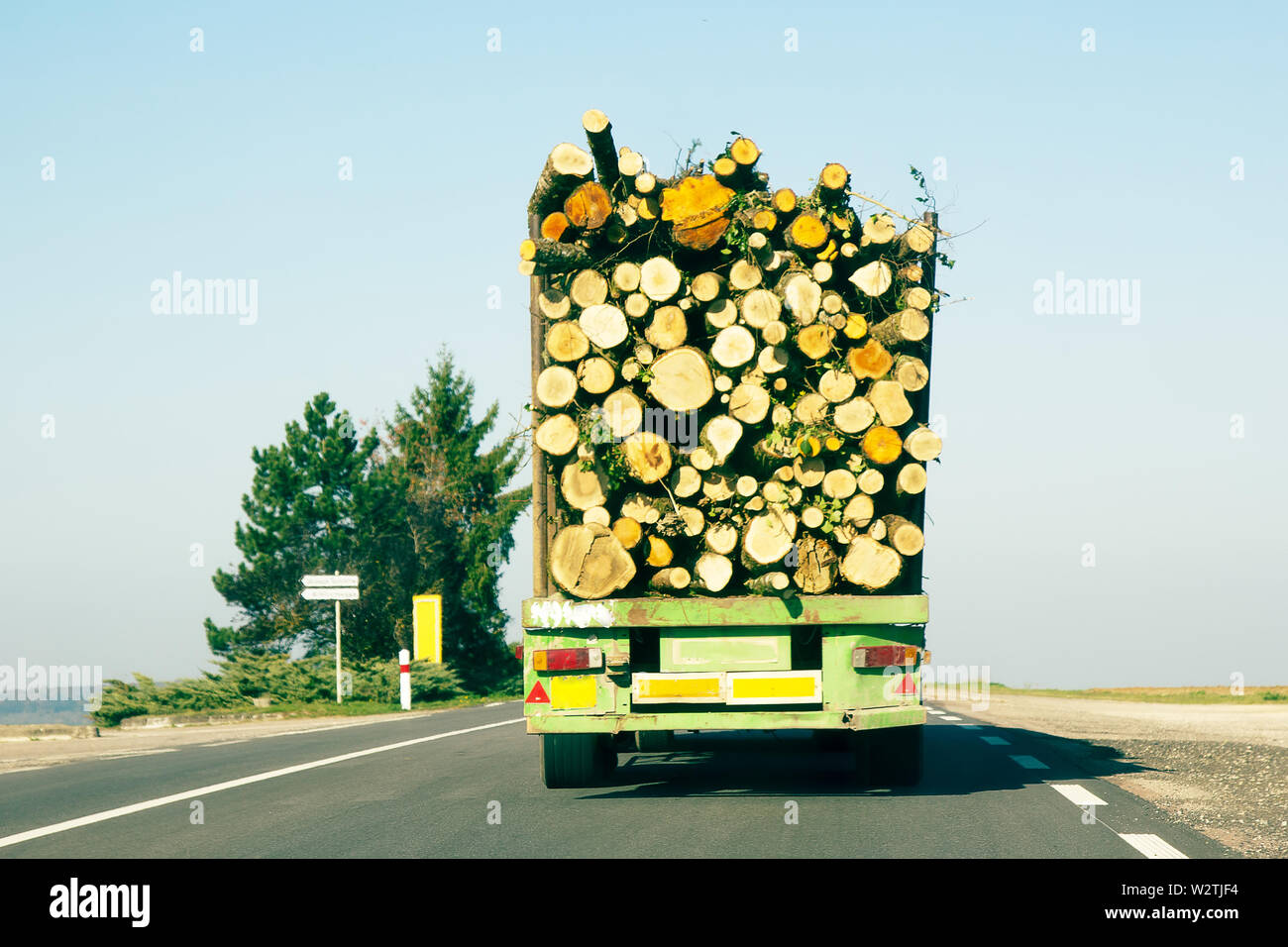 Logging truck on the highway with a load of cut trees. French forestry ...