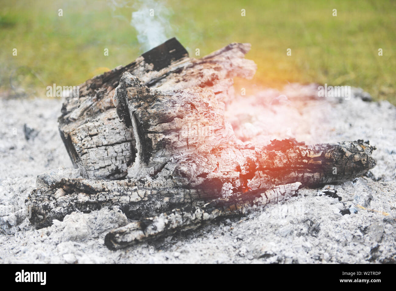 ash bonfire campfire wood burning charcoal and smoke on outdoors ...