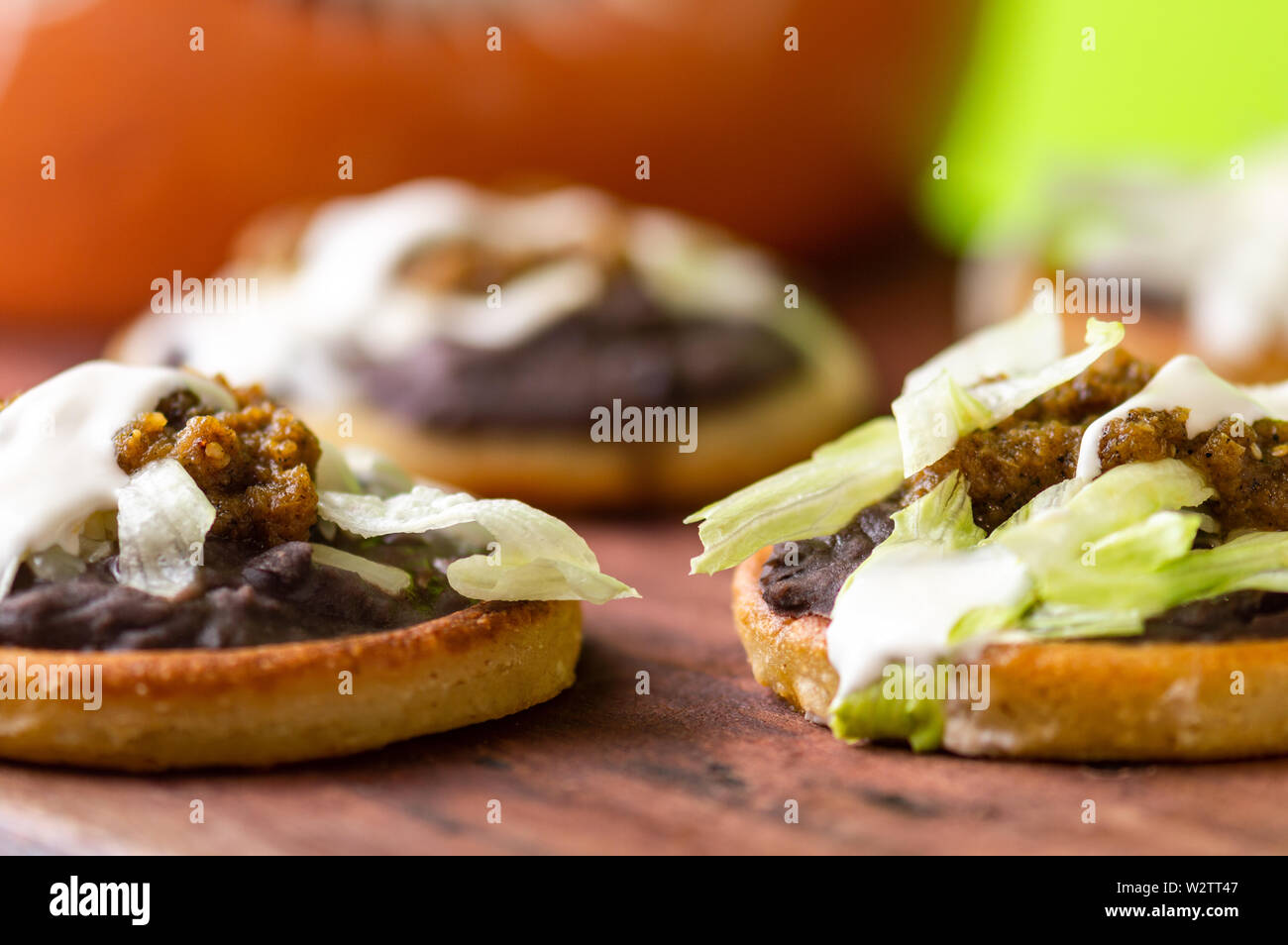 Sopes, Mexican food, corn tortilla with black beans, lettuce, cheese ...