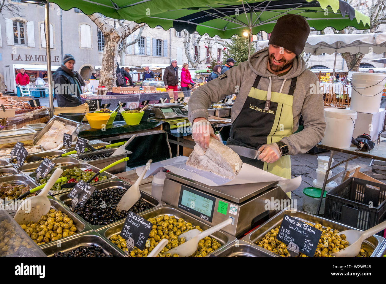 Uzes, France - January 19, 2019: the market of the Place aux Herbes at ...