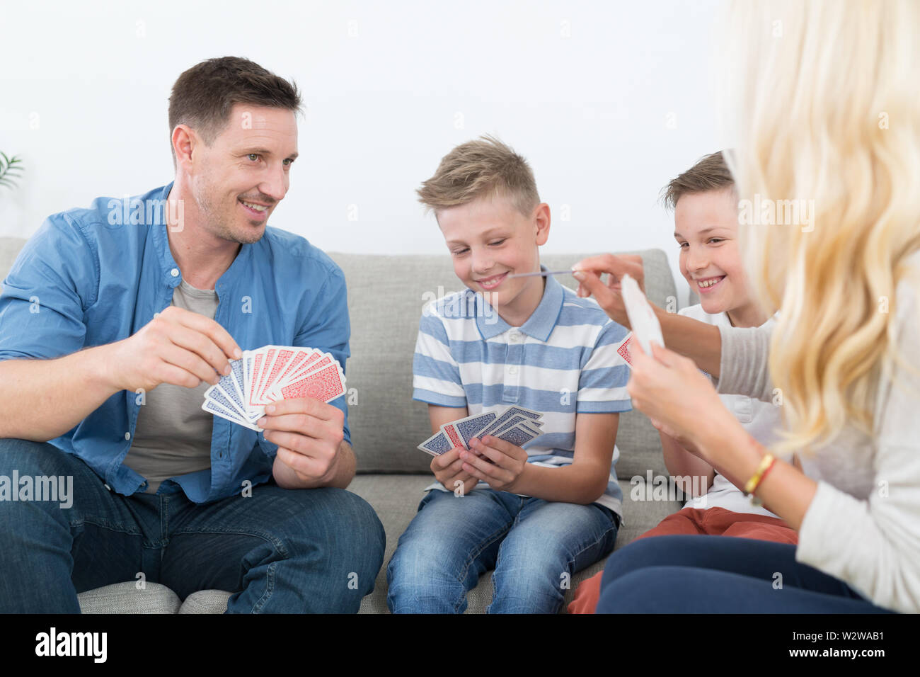 Children playing cards family hi-res stock photography and images - Alamy