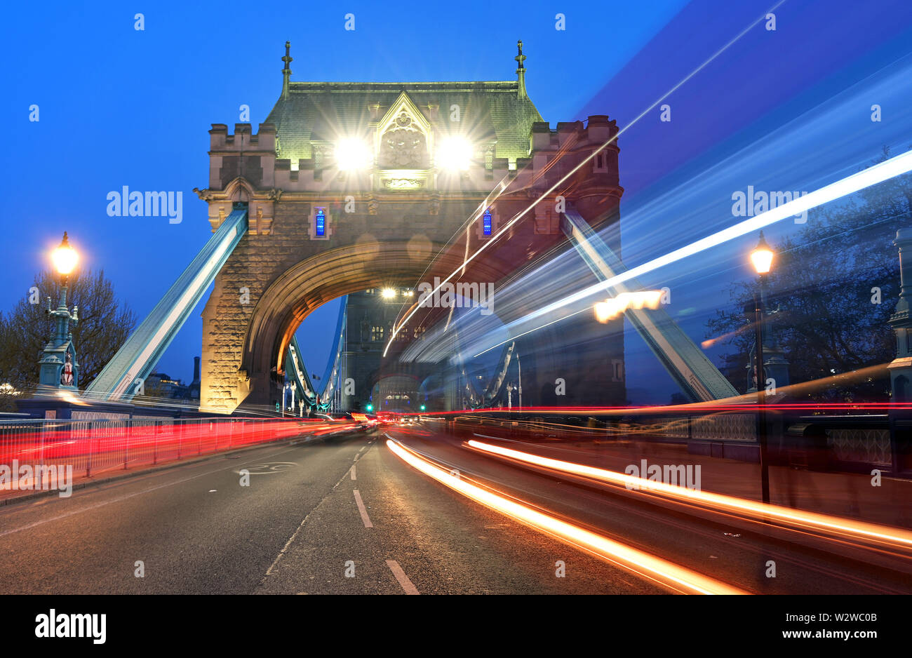 Vehicles pass over Tower Bridge across the River Thames in London, UK ...