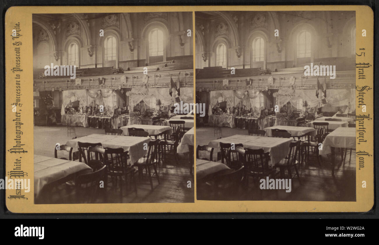 Interior of a large hall showing booths set up for a fair (Dining ...