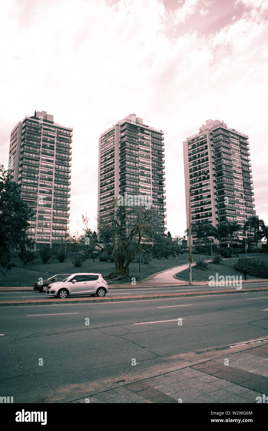 Three modern buildings located facing the sea and with a street Stock ...