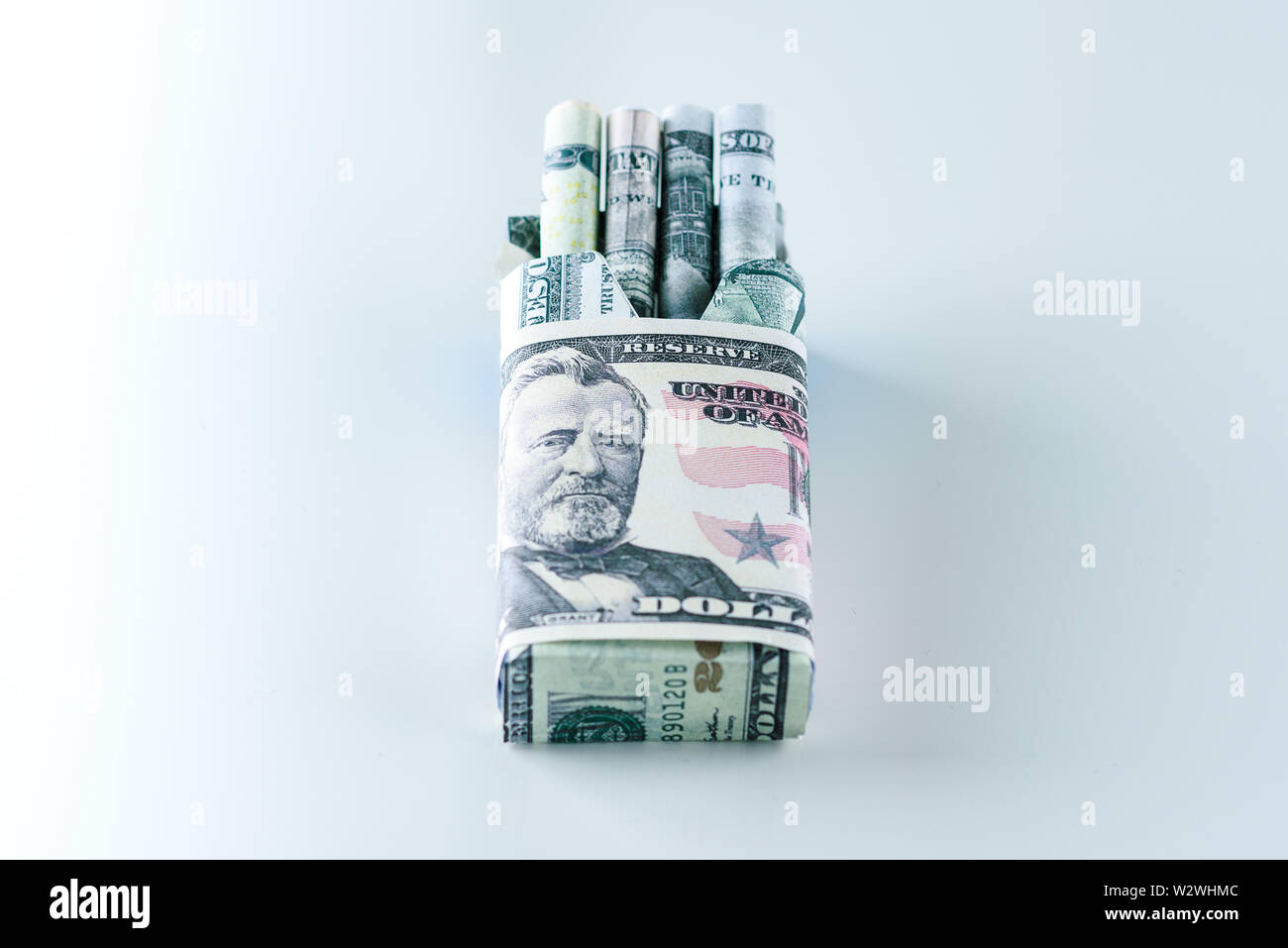 Package of cigarette filled with paper money dollars banknote instead ...