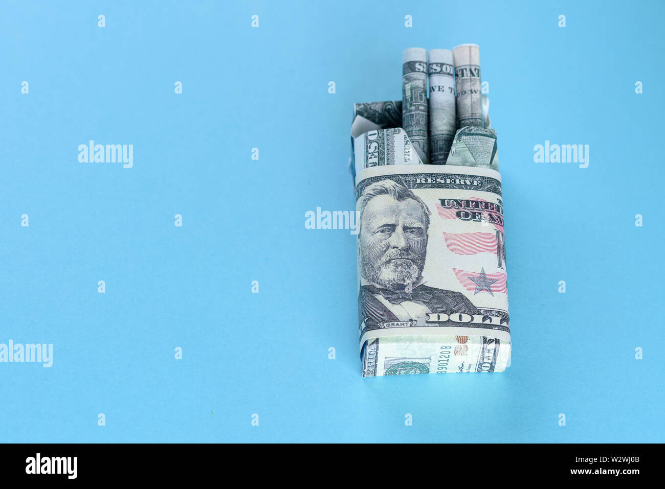 Burning money cigarette hi-res stock photography and images - Alamy