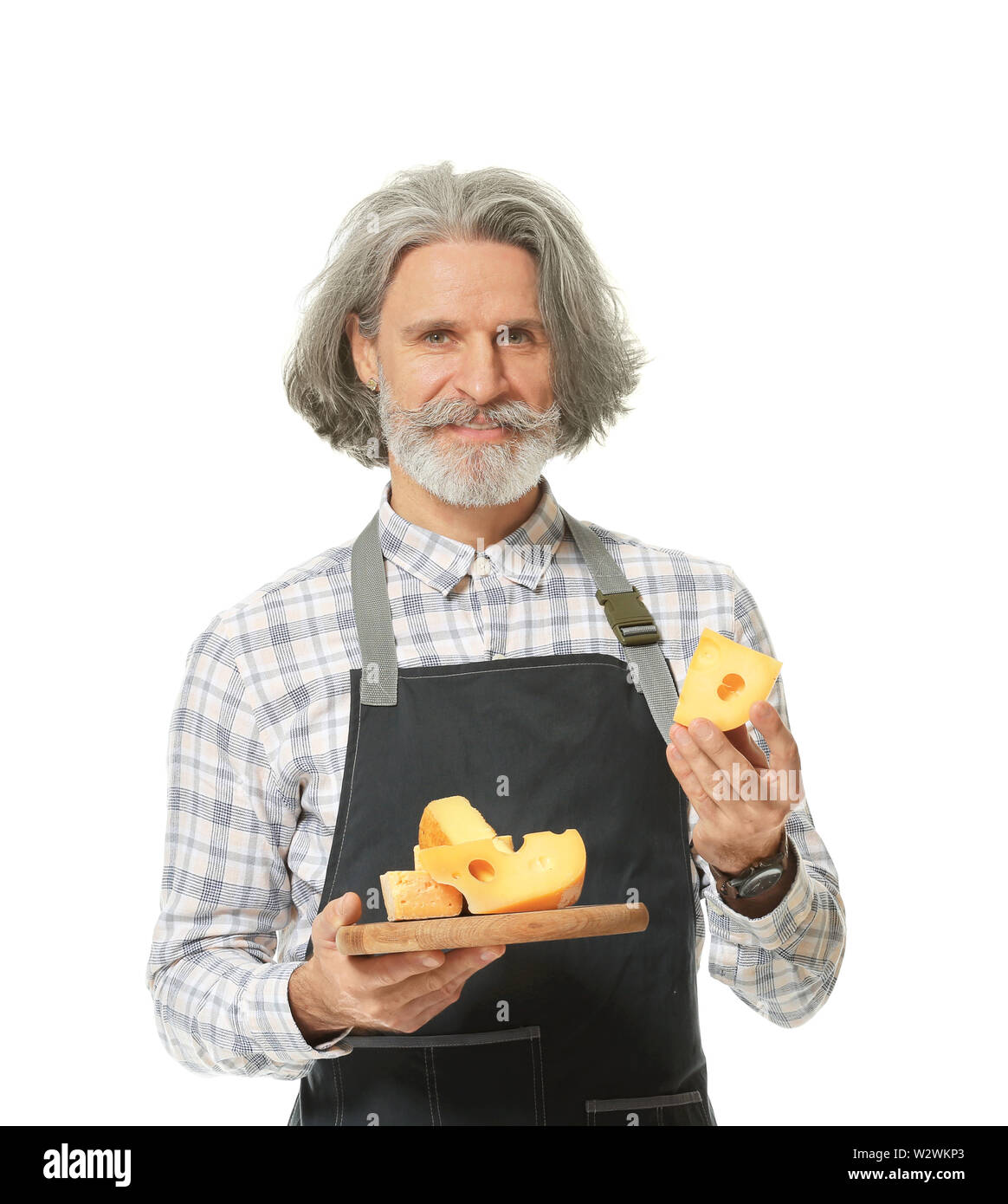 Male owner of cheese store on white background Stock Photo - Alamy
