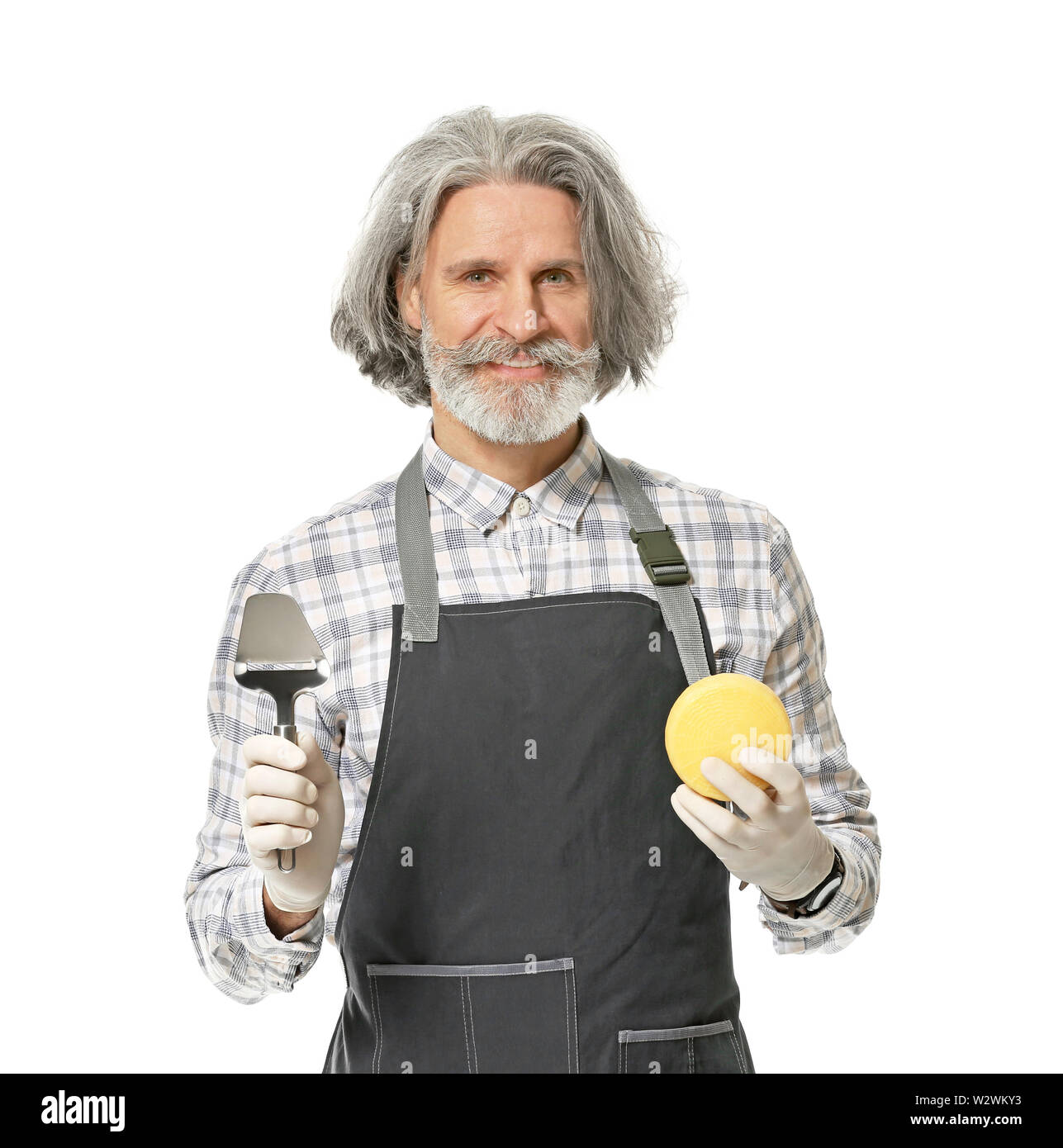 Male owner of cheese store on white background Stock Photo - Alamy