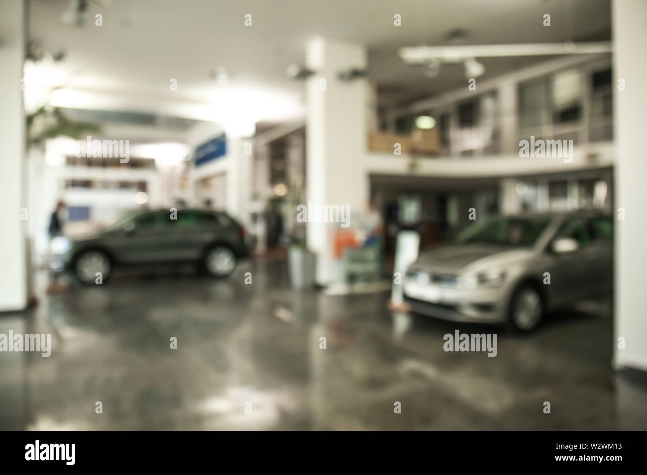 Interior of modern car showroom, blurred view Stock Photo - Alamy