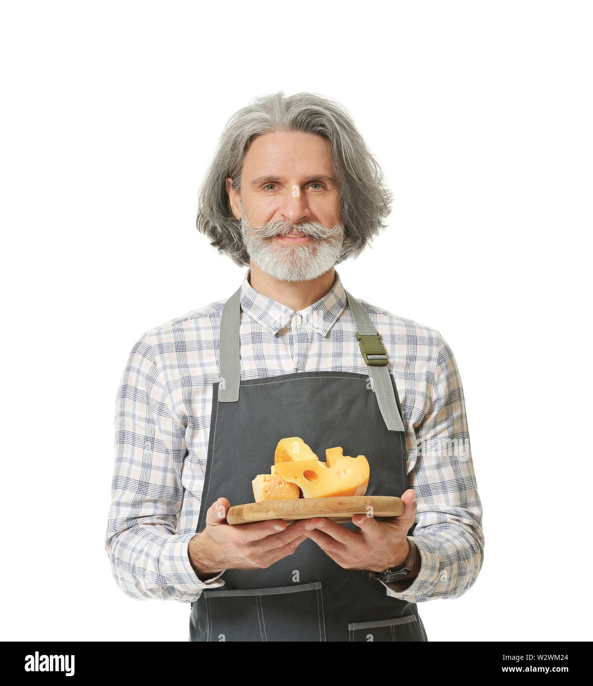 Male owner of cheese store on white background Stock Photo - Alamy