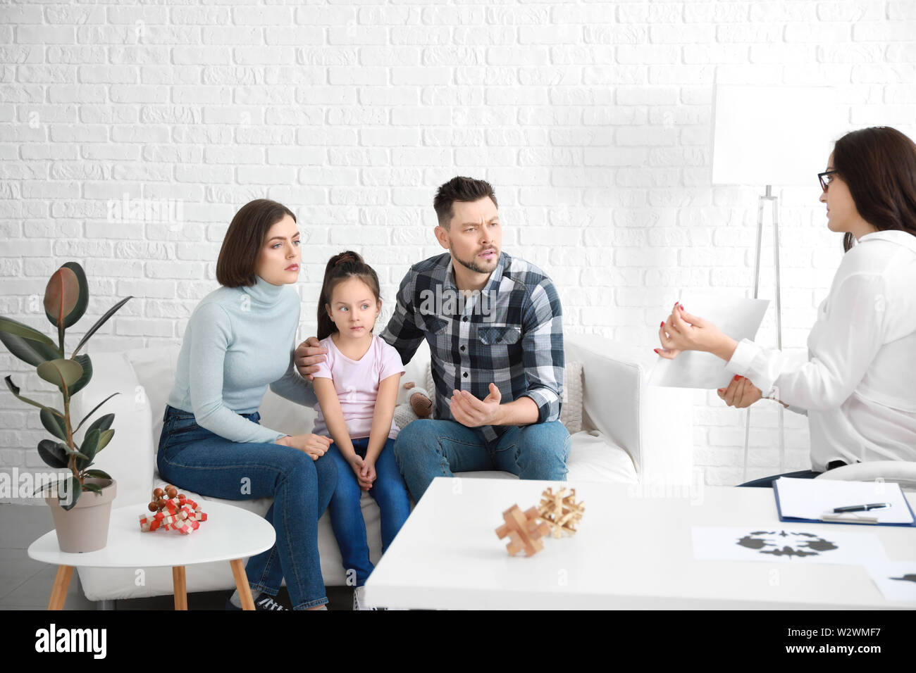 Family visiting psychologist in office Stock Photo - Alamy