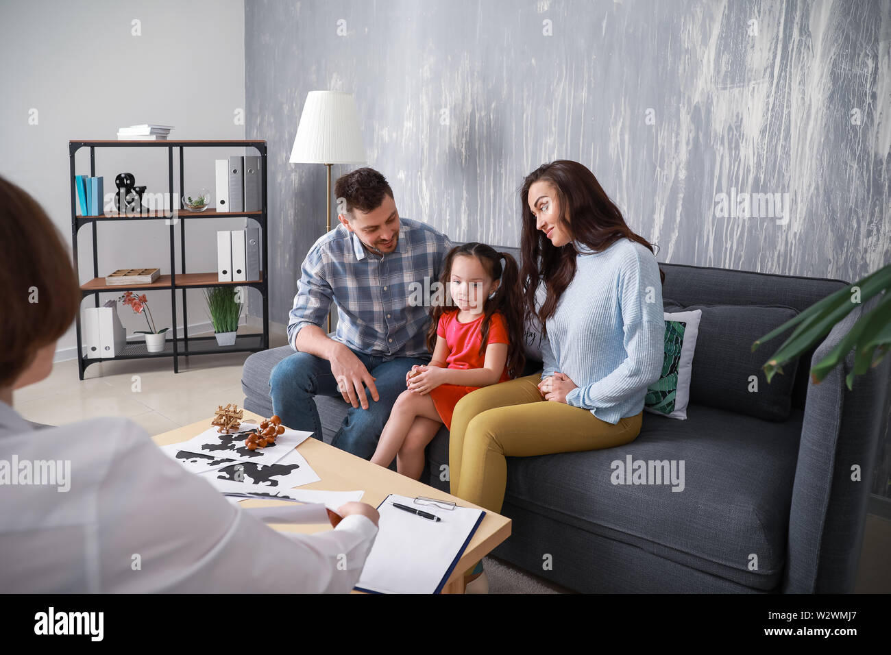 Family visiting psychologist in office Stock Photo - Alamy