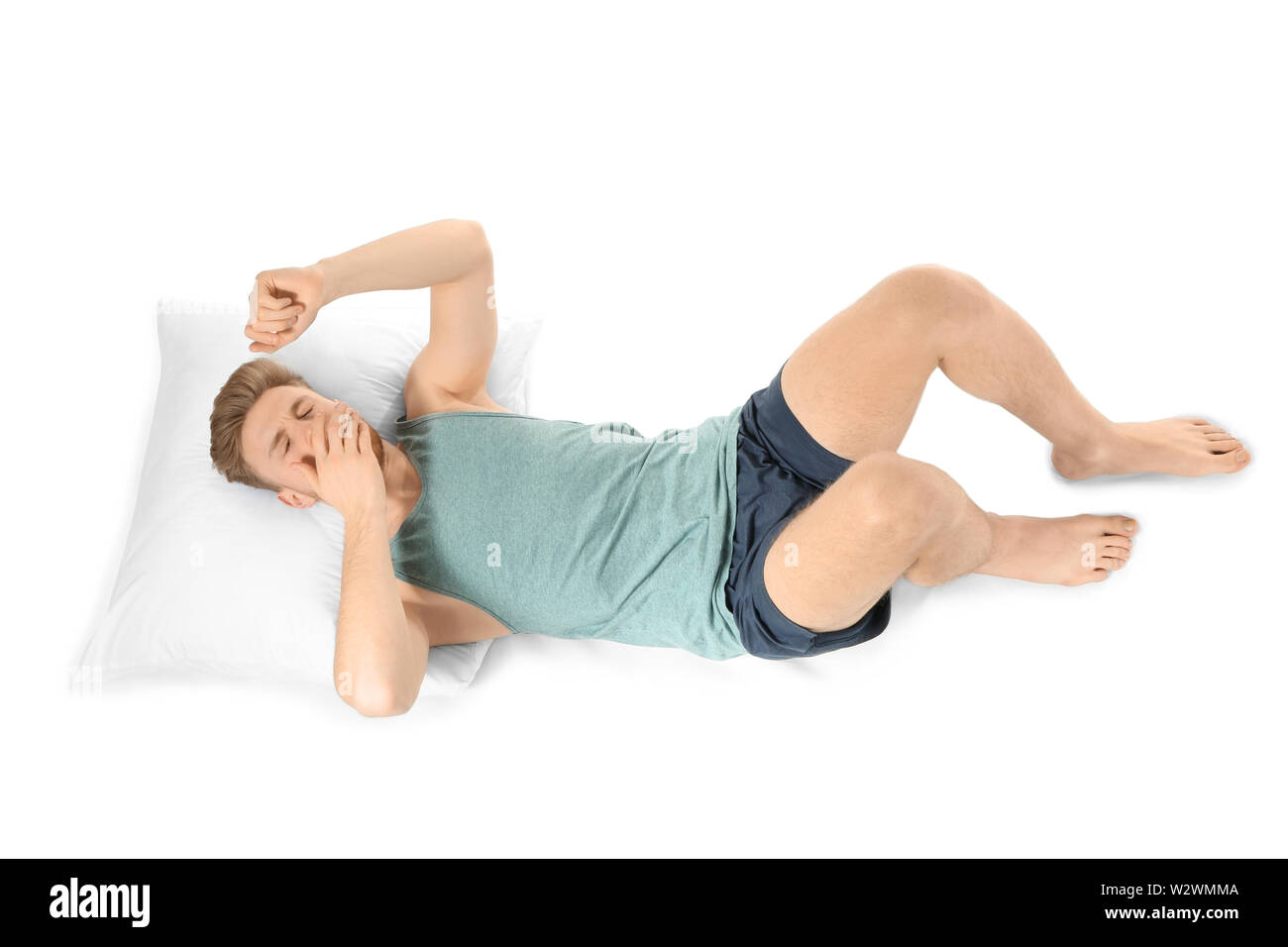 Sleepy young man yawning Cut Out Stock Images & Pictures - Alamy