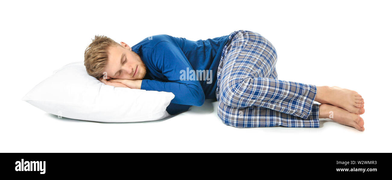 Handsome sleeping man with pillow on white background Stock Photo - Alamy