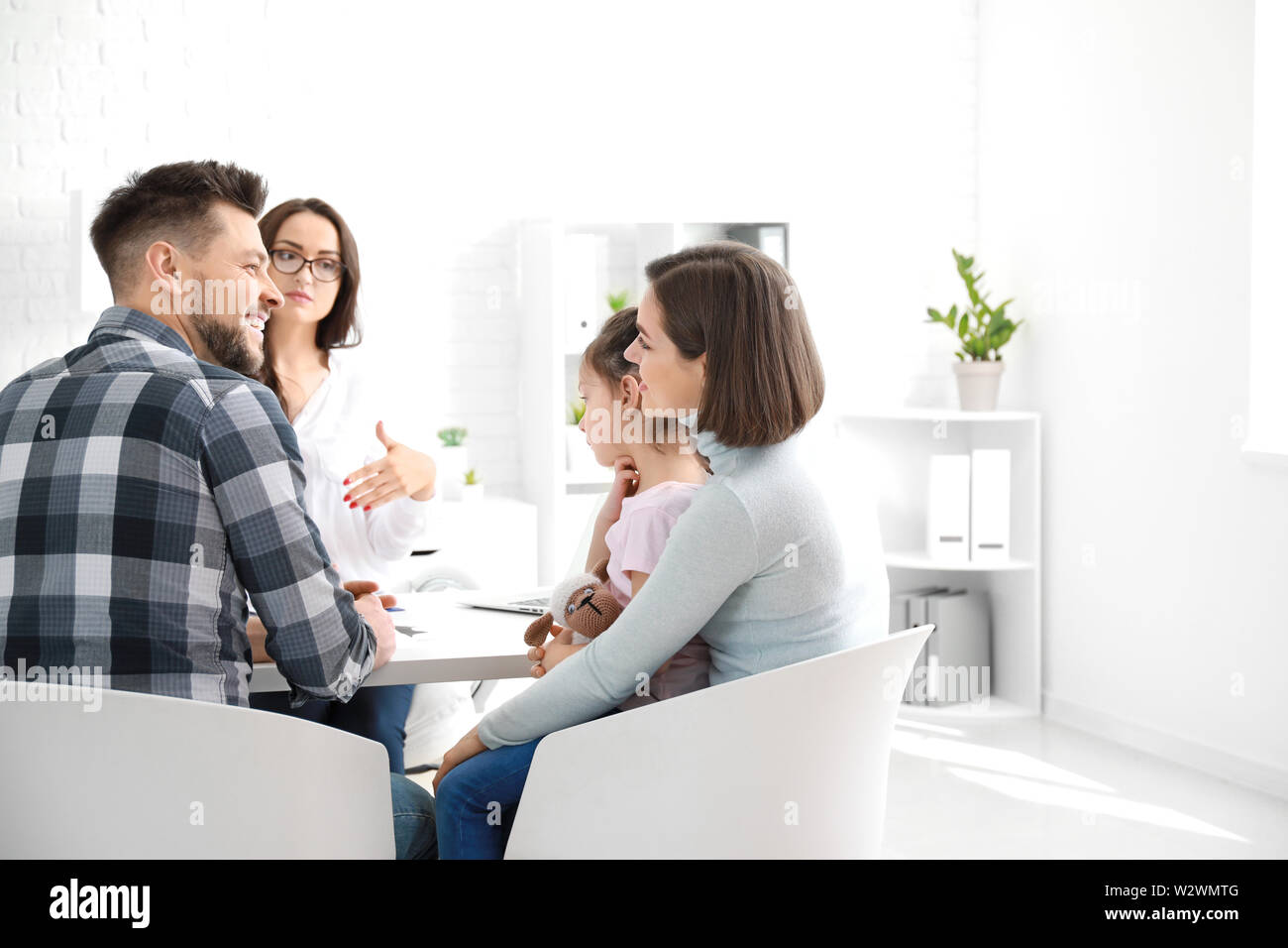 Family visiting psychologist in office Stock Photo - Alamy