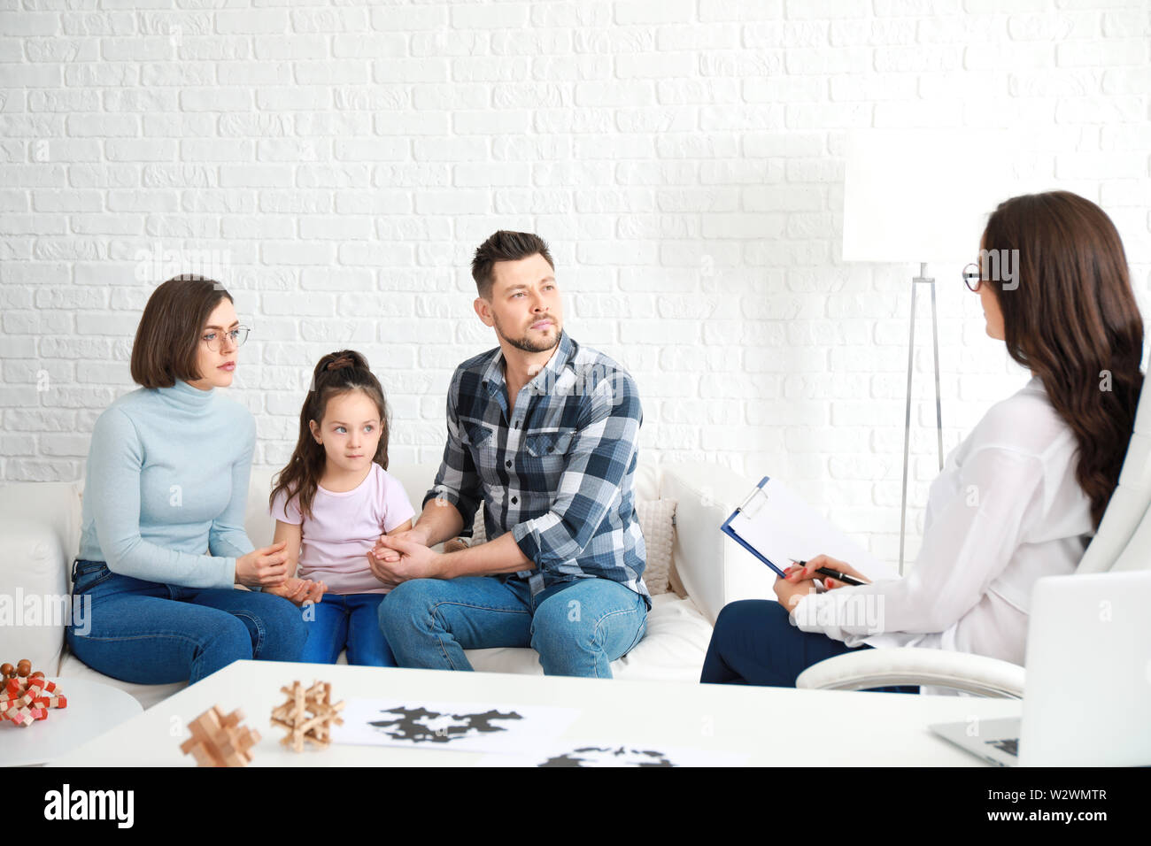Family visiting psychologist in office Stock Photo - Alamy