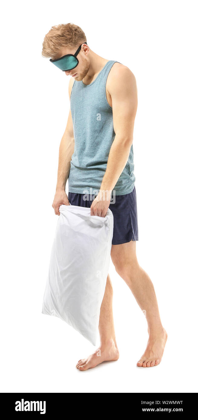 Male sleepwalker on white background Stock Photo - Alamy