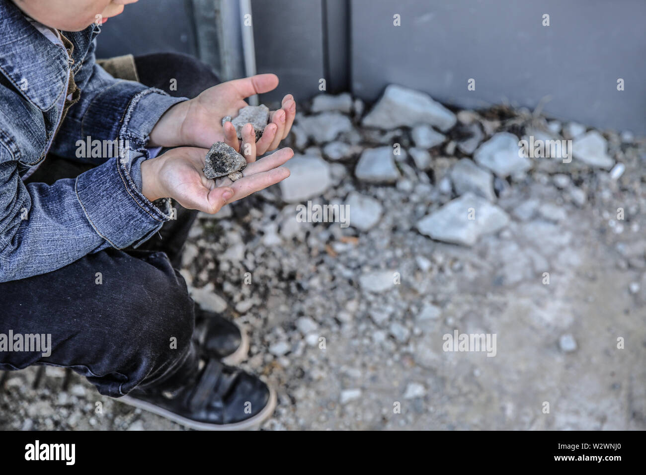 Homeless little boy outdoors Stock Photo - Alamy