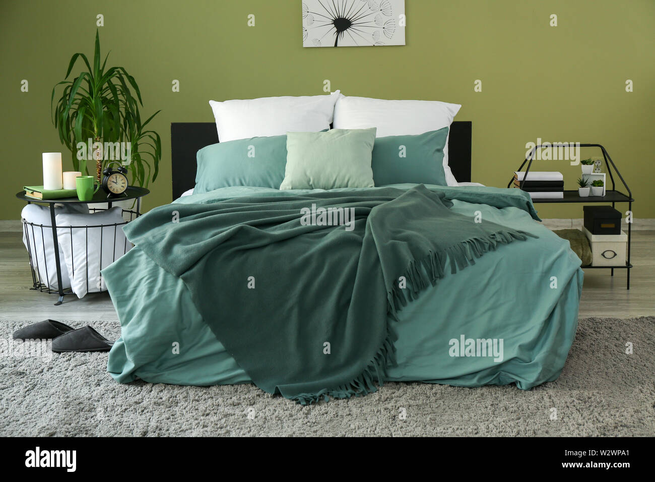 Big comfortable bed in stylish interior of room Stock Photo - Alamy