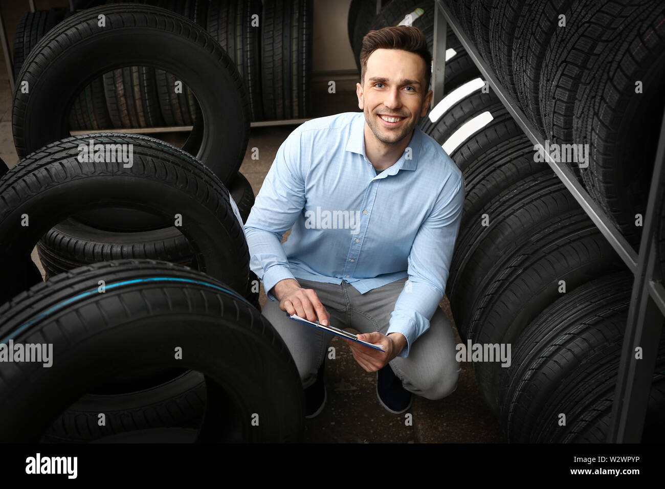 Man sitting in car tyre hi-res stock photography and images - Alamy