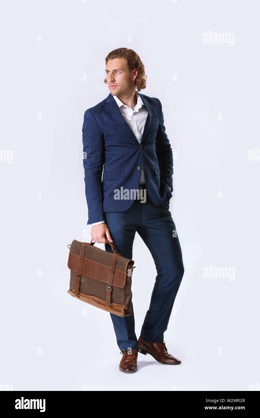 Stylish young man in formal clothes on white background Stock Photo - Alamy