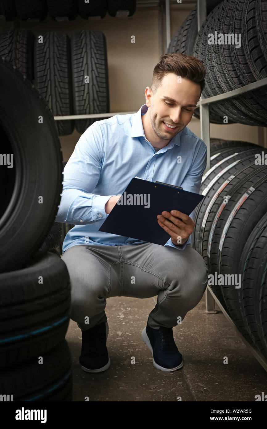 Man sitting in car tyre hi-res stock photography and images - Alamy