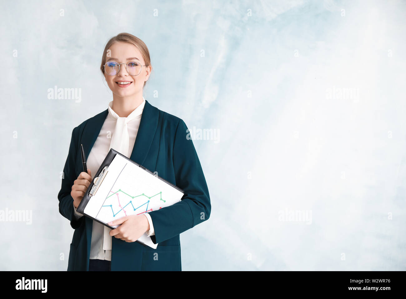 Portrait of female accountant on light background Stock Photo - Alamy