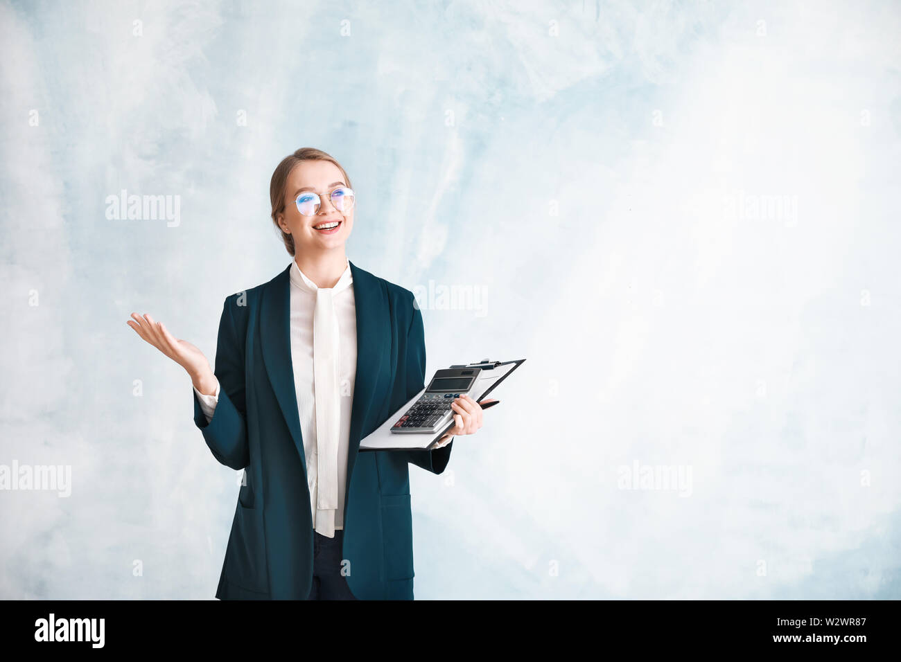 Portrait of female accountant on light background Stock Photo - Alamy