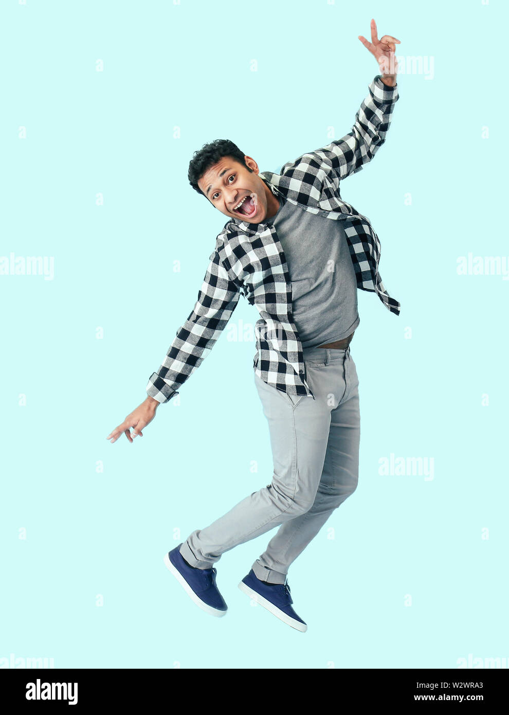 Funny jumping man on color background Stock Photo - Alamy
