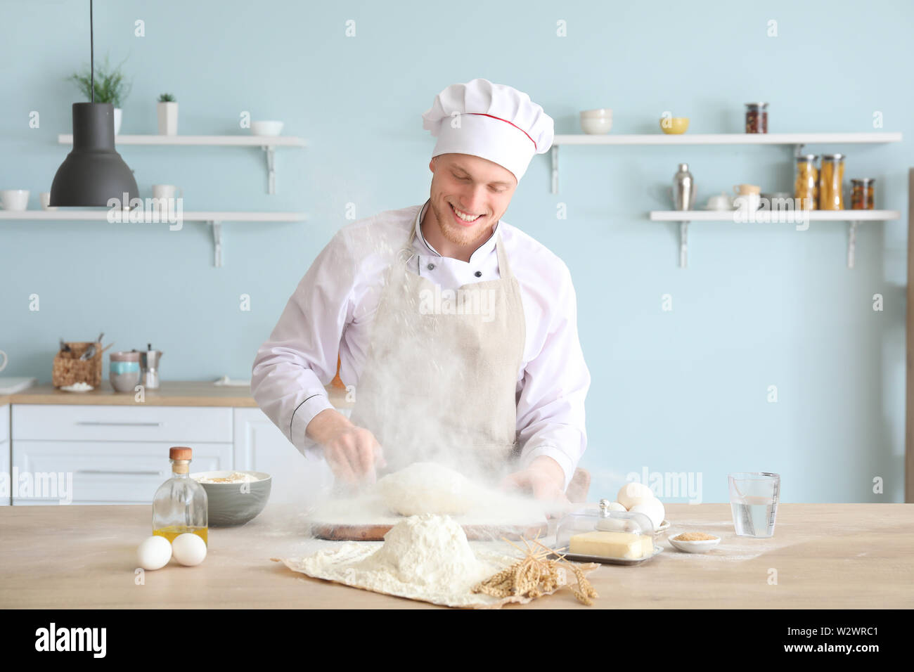 Chef making dough in kitchen Stock Photo - Alamy