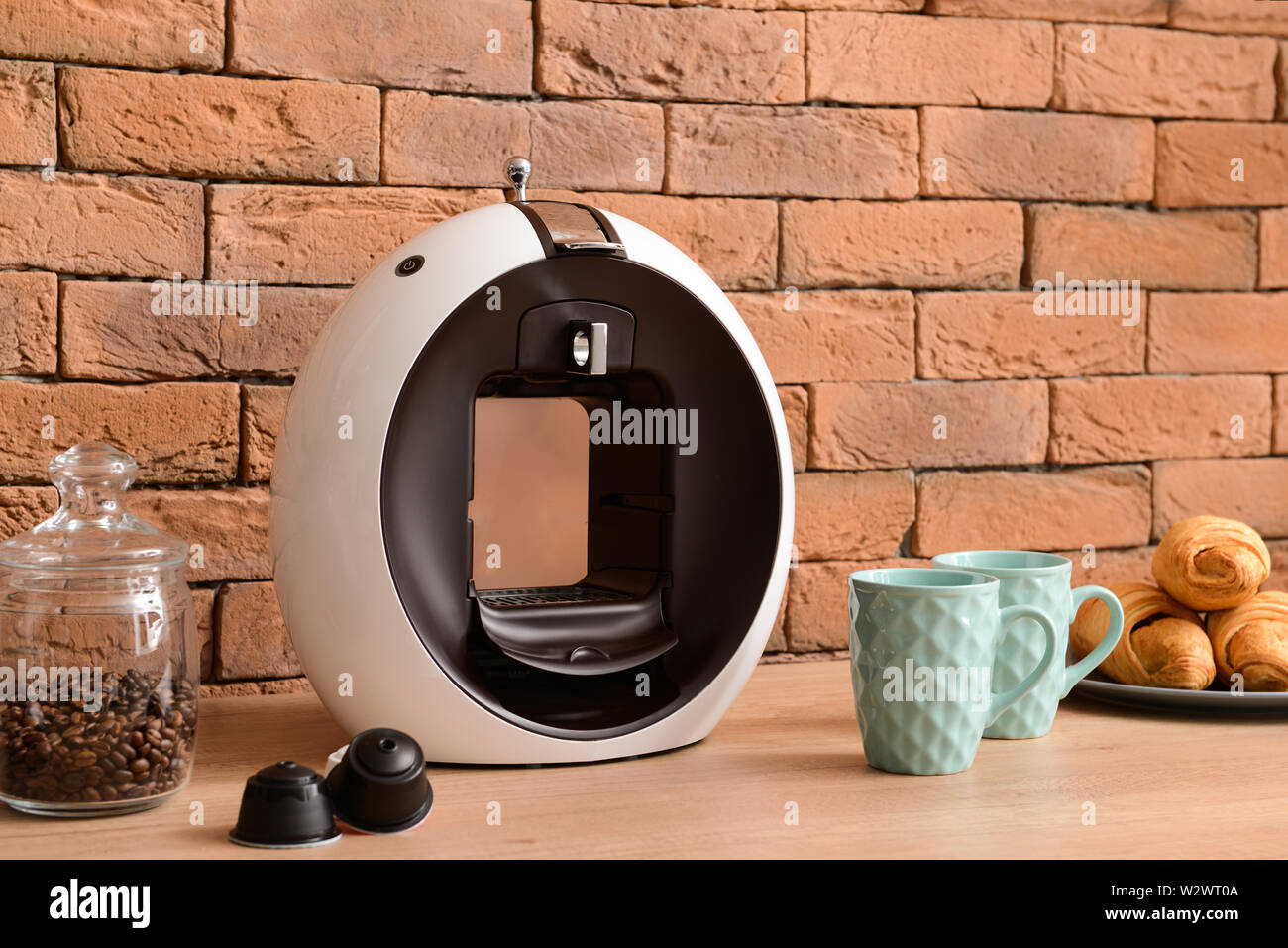 Modern coffee machine on table in kitchen Stock Photo - Alamy