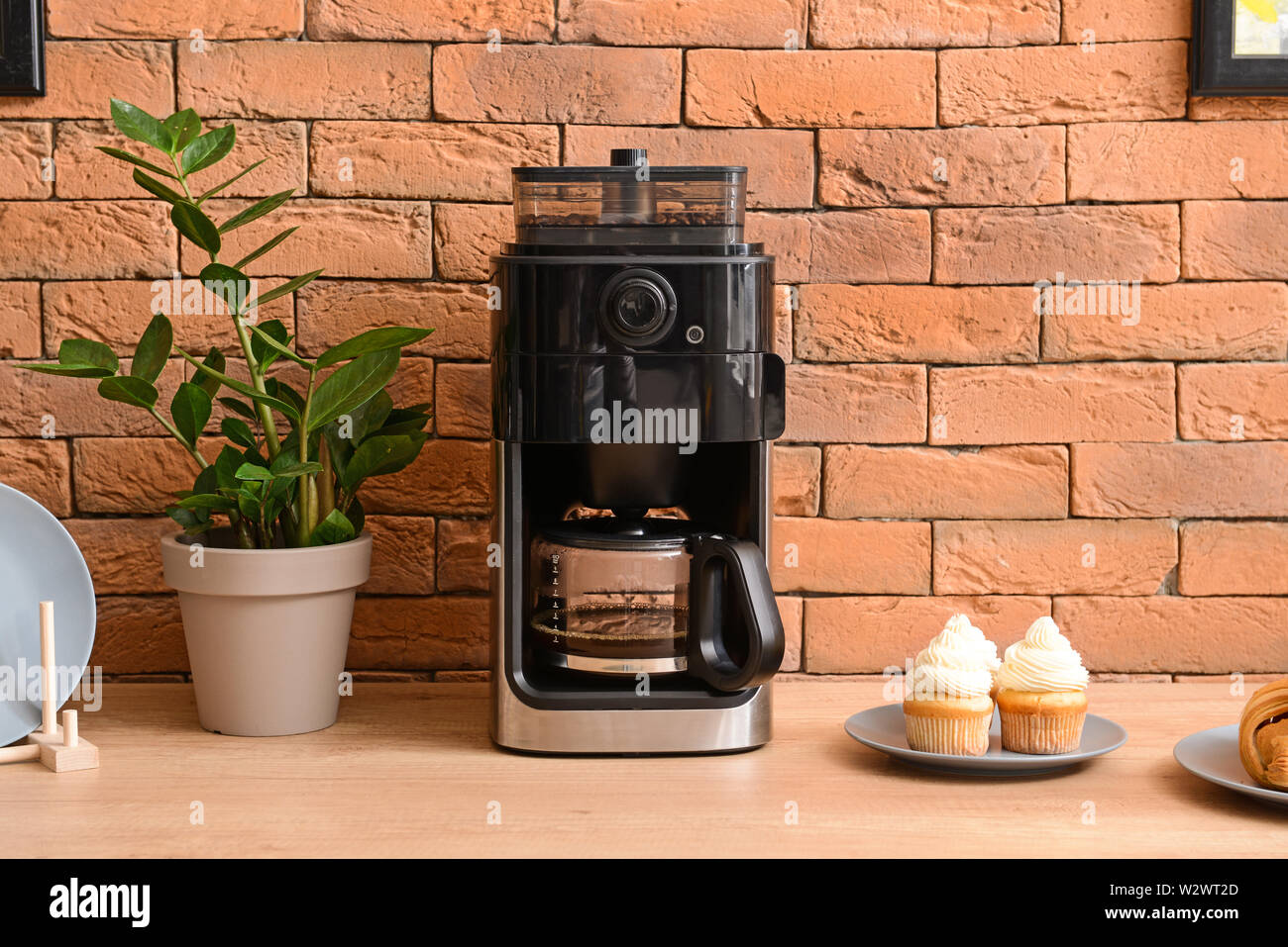 Modern coffee machine on table in kitchen Stock Photo - Alamy