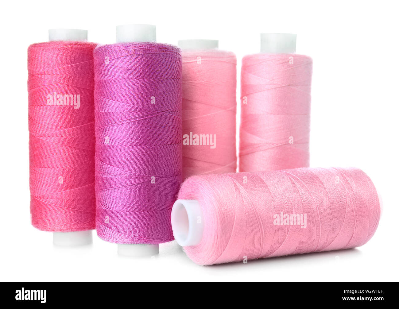 Bright sewing threads on white background Stock Photo - Alamy
