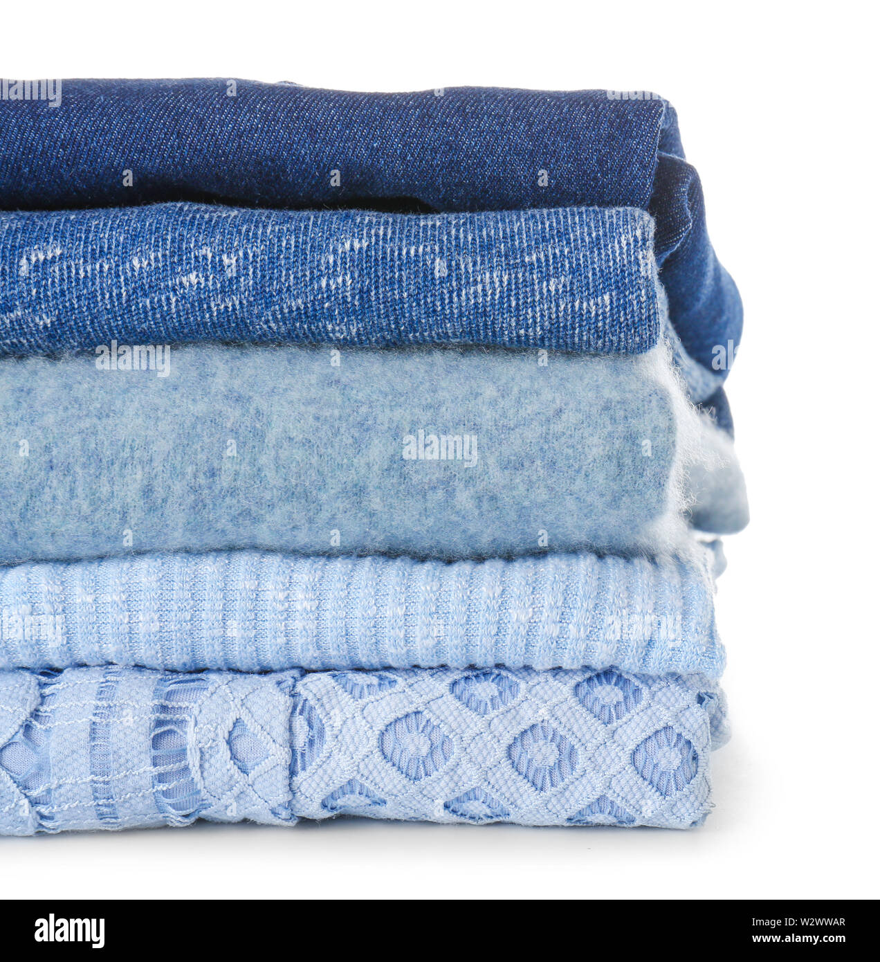 Stack of clean clothes on white background Stock Photo - Alamy