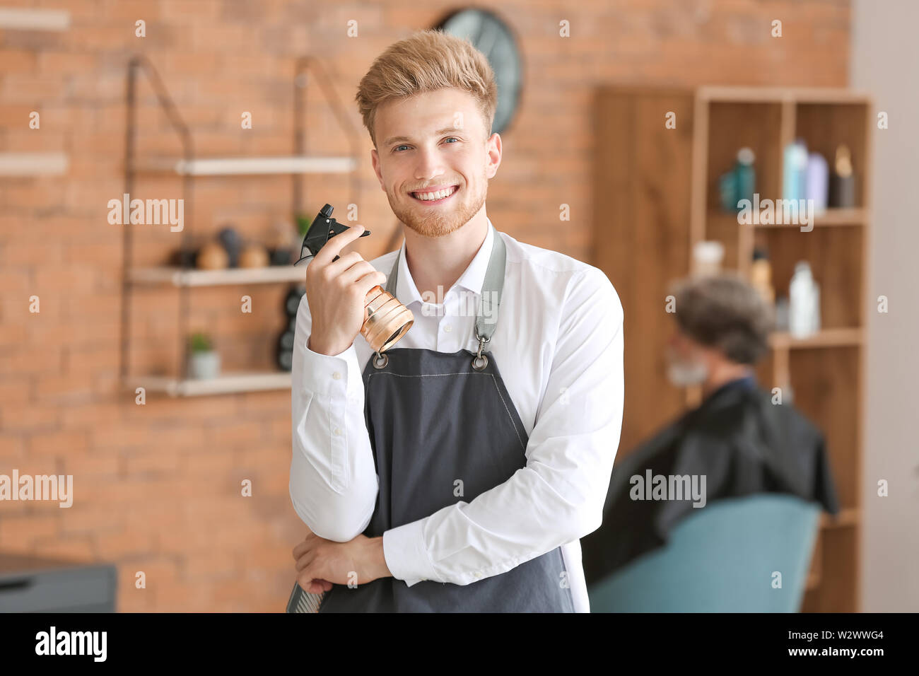 Young male hairdresser hi-res stock photography and images - Alamy