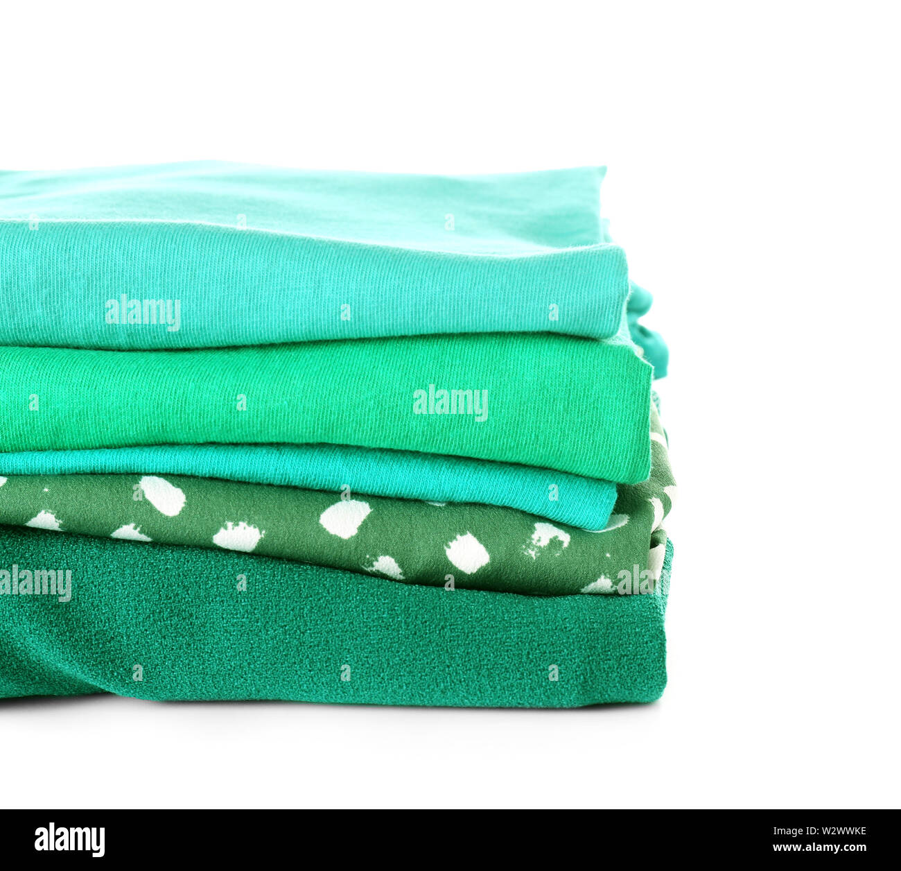 Stack of clean clothes on white background Stock Photo - Alamy