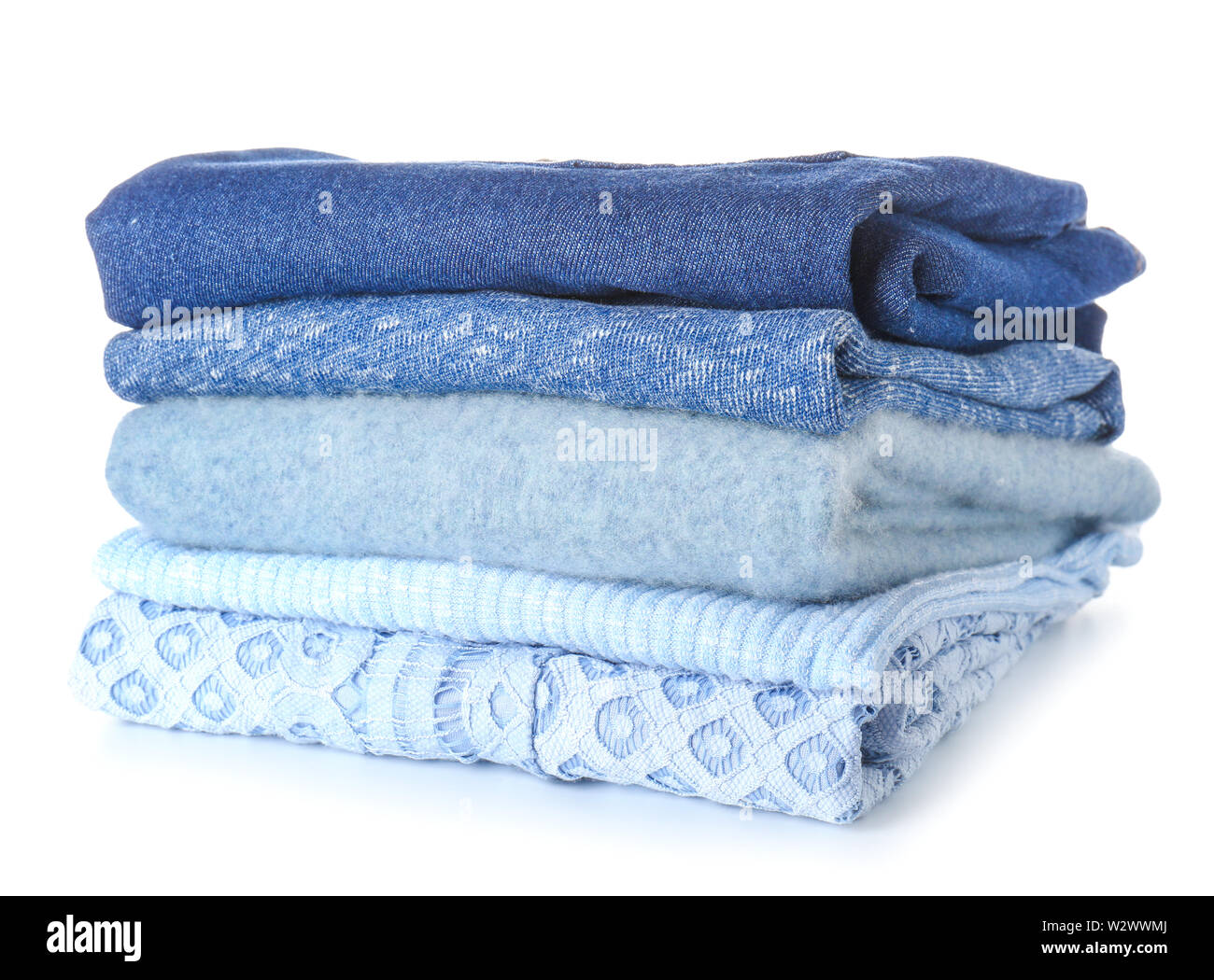Stack of clean clothes on white background Stock Photo - Alamy