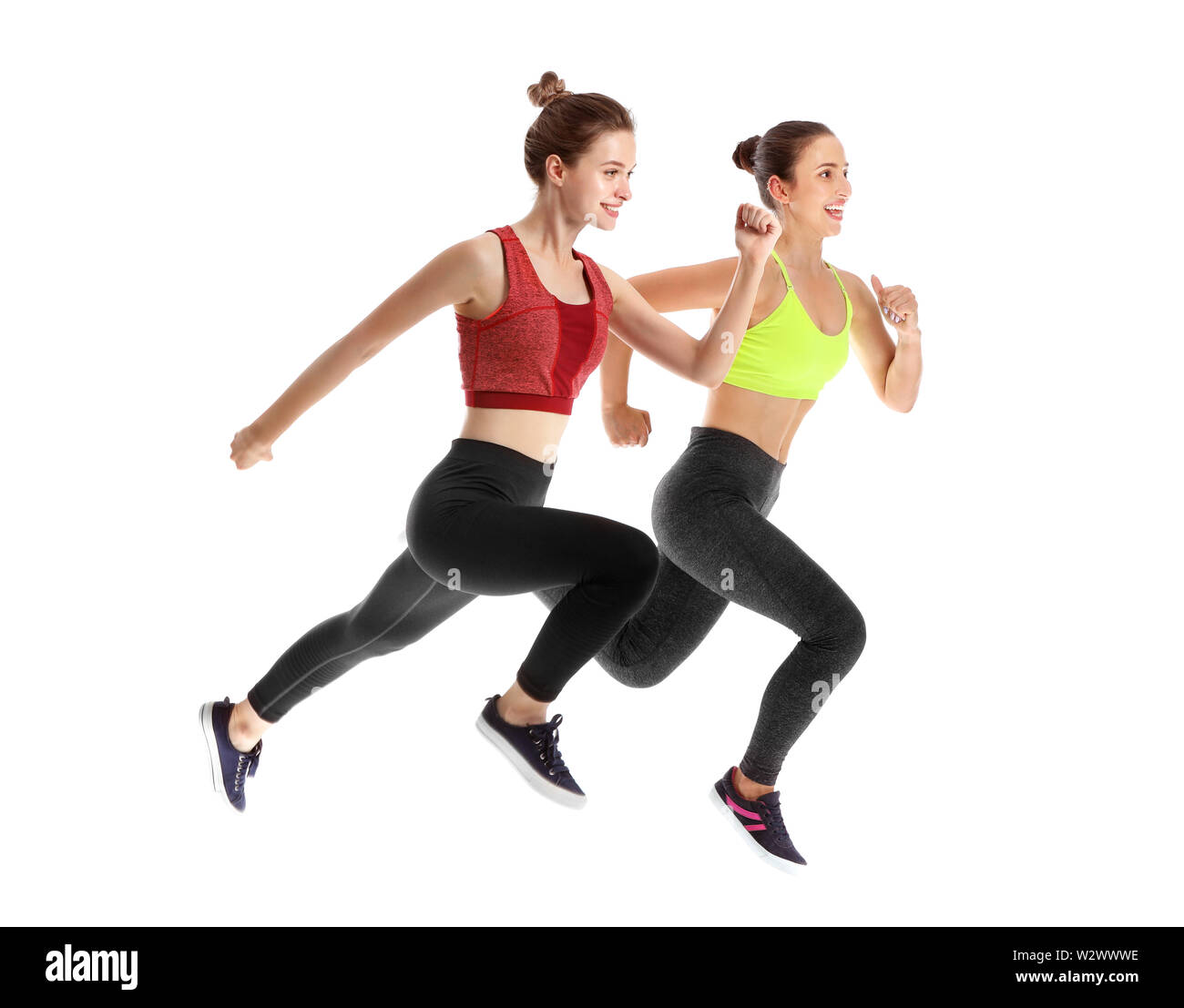 Running sporty women on white background Stock Photo - Alamy