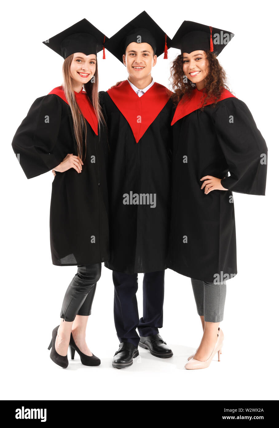 Young students in bachelor robes on white background Stock Photo - Alamy