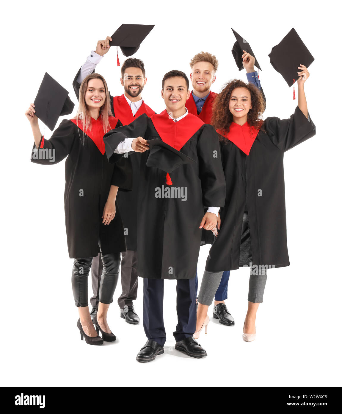 Young students in bachelor robes on white background Stock Photo - Alamy