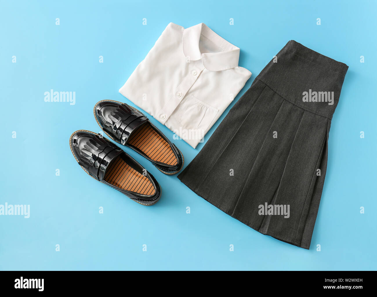 School uniform on color background Stock Photo - Alamy