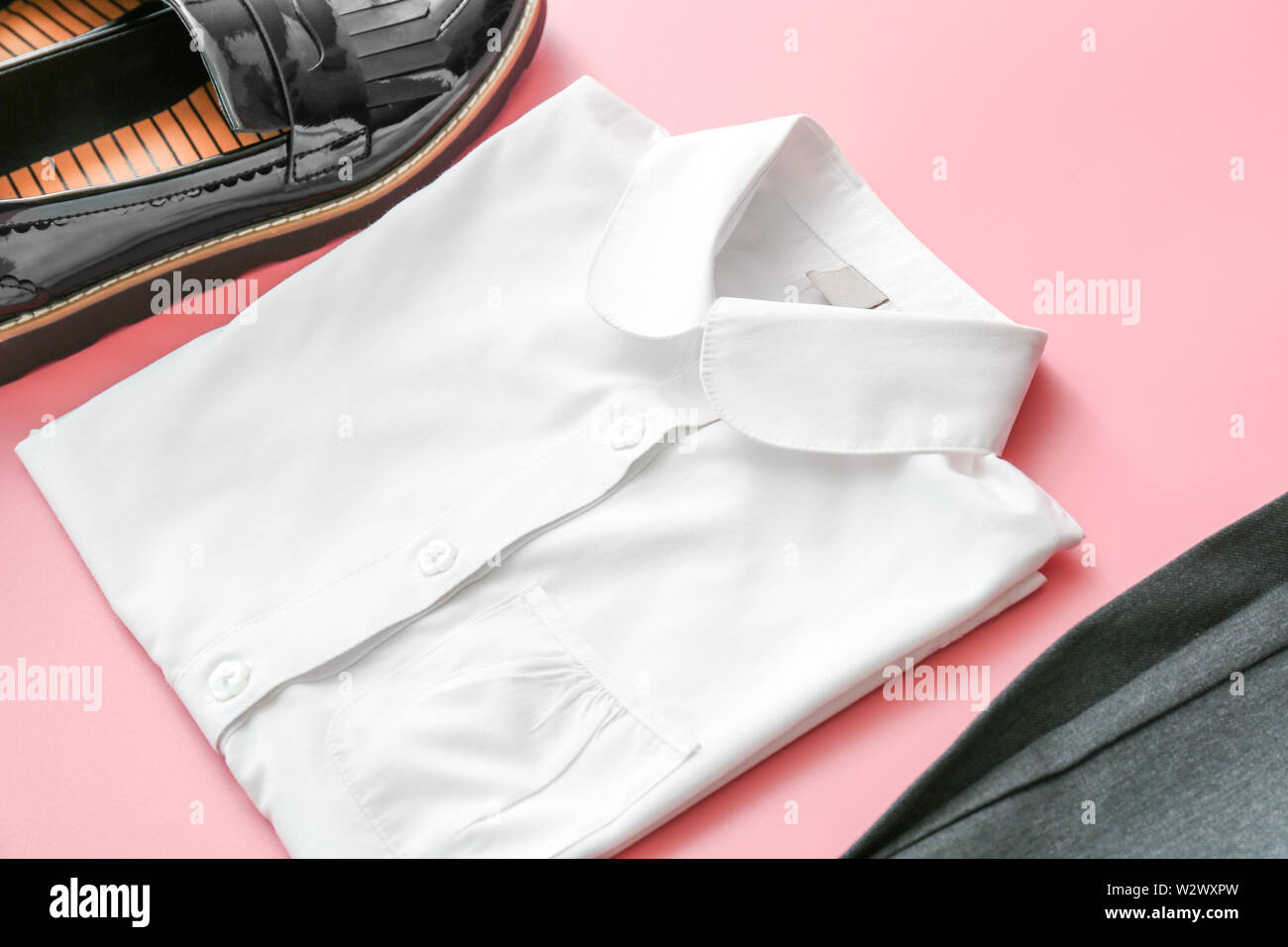 School uniform on color background Stock Photo - Alamy