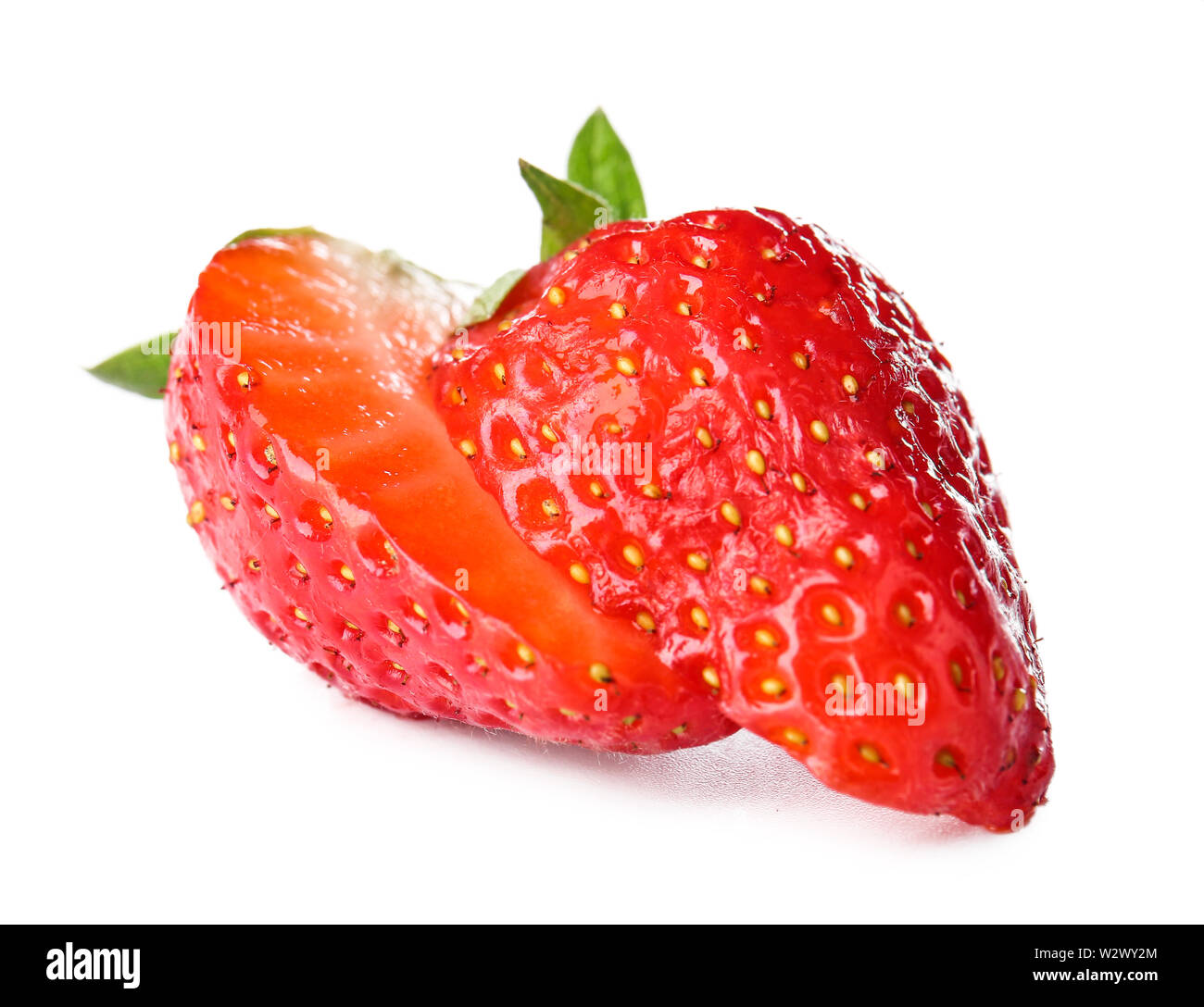 Sweet cut strawberry on white background Stock Photo - Alamy