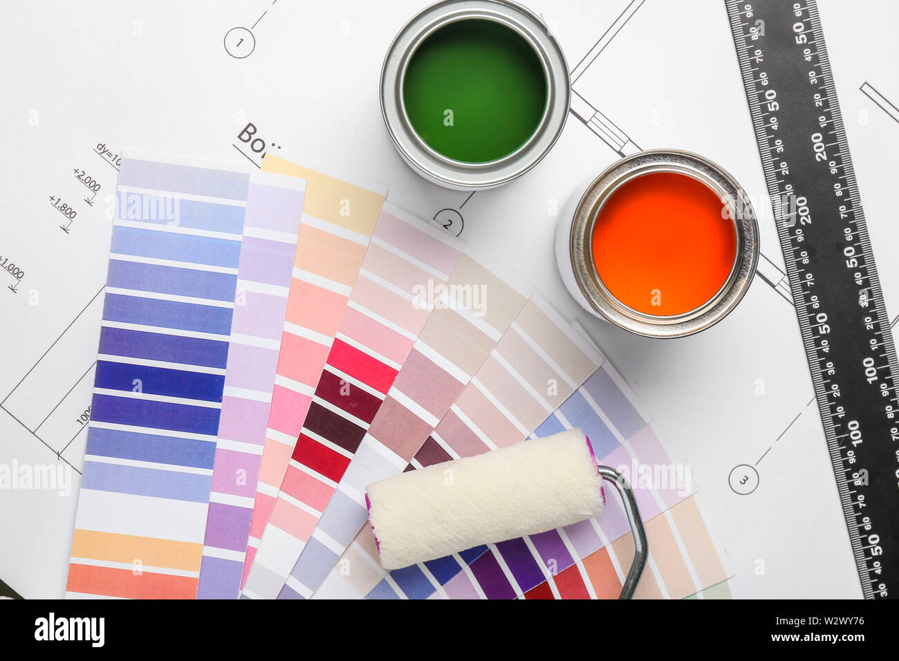 Cans of paint with supplies and palette samples Stock Photo - Alamy