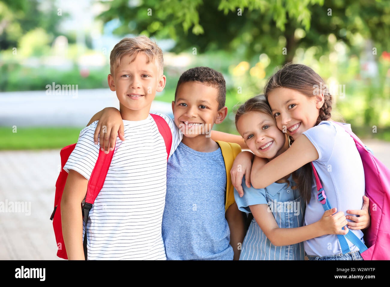 Group of cute little pupils outdoors Stock Photo - Alamy