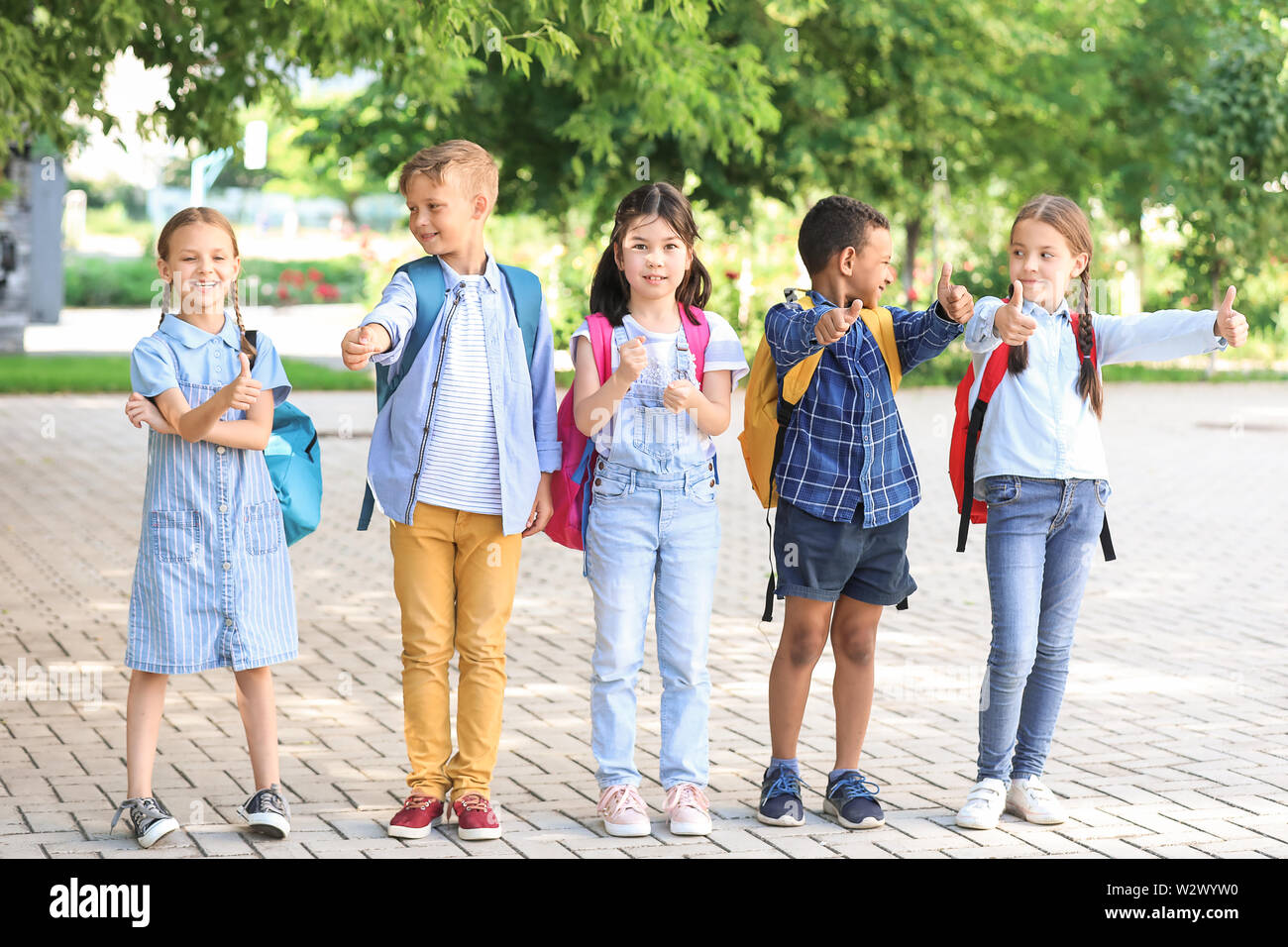 Group of cute little pupils outdoors Stock Photo - Alamy