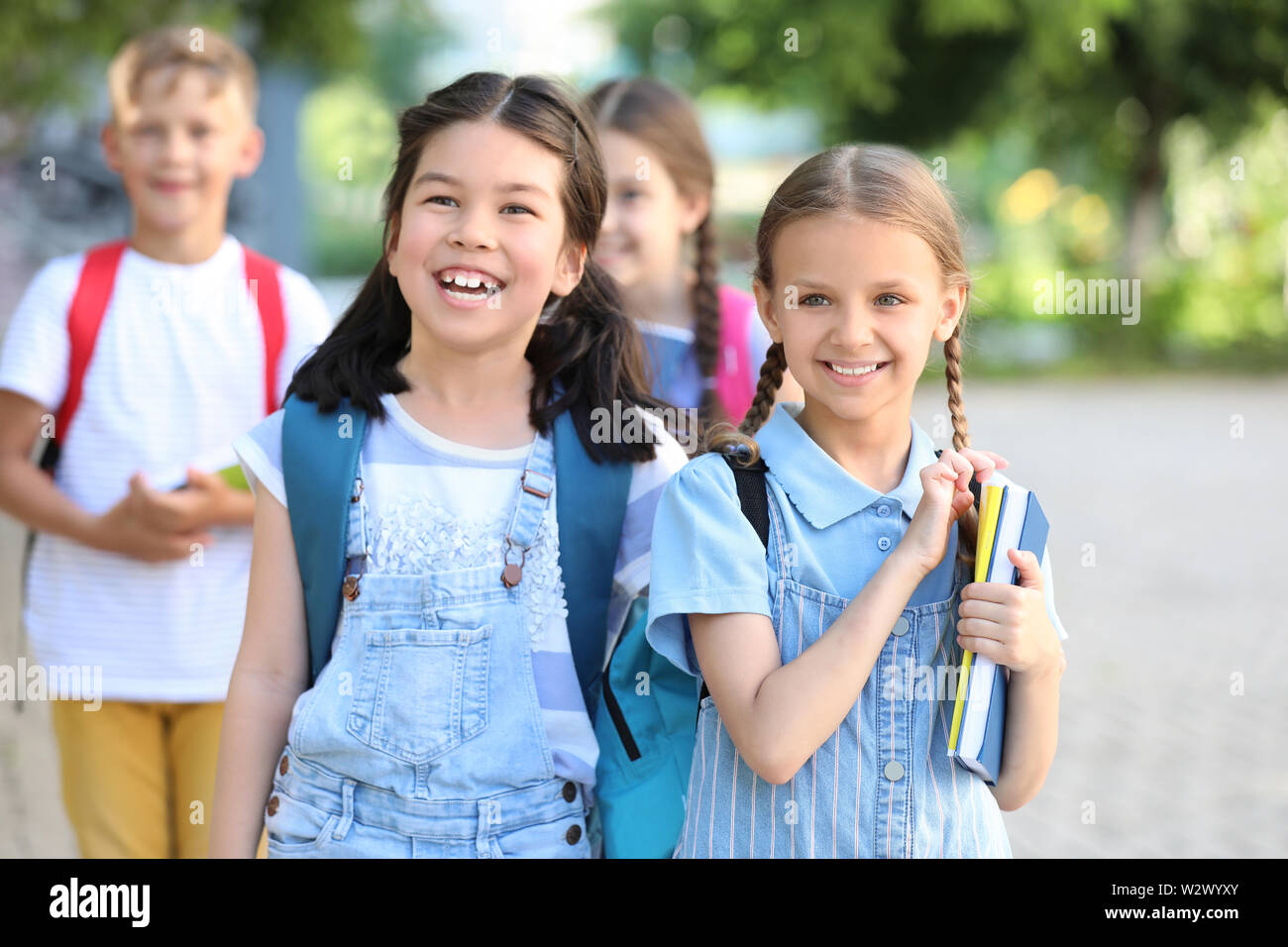 Group of cute little pupils outdoors Stock Photo - Alamy